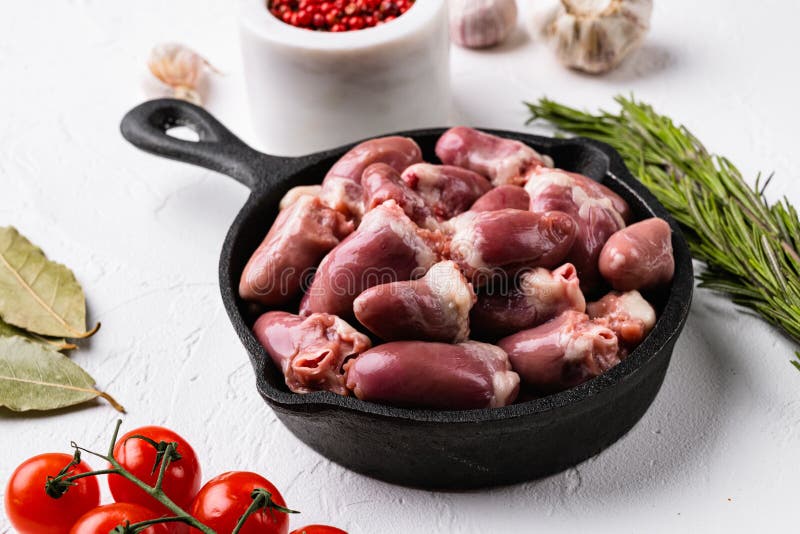 Raw Uncooked Chicken Gizzards, Chicken Hearts, on White Stone Table ...