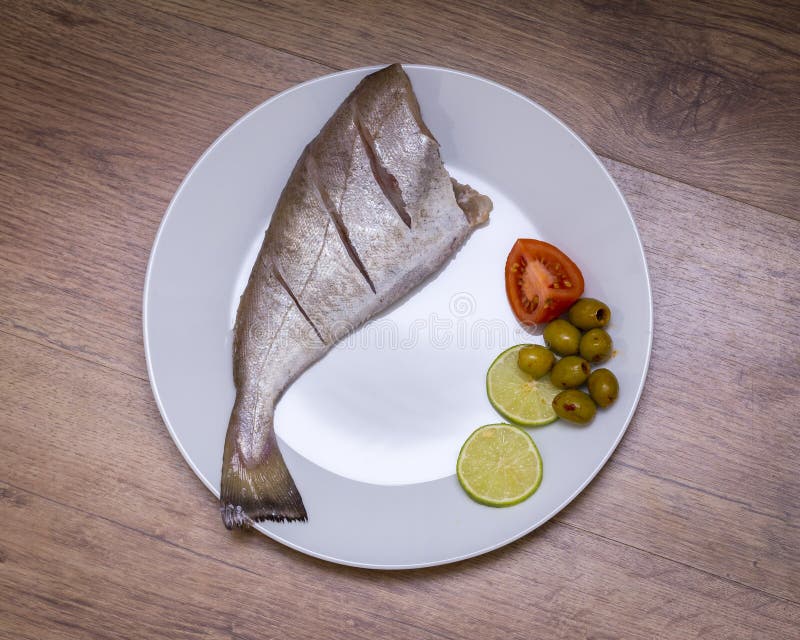 Raw uncooked fish on plate stock photo. Image of ingredient - 110311466