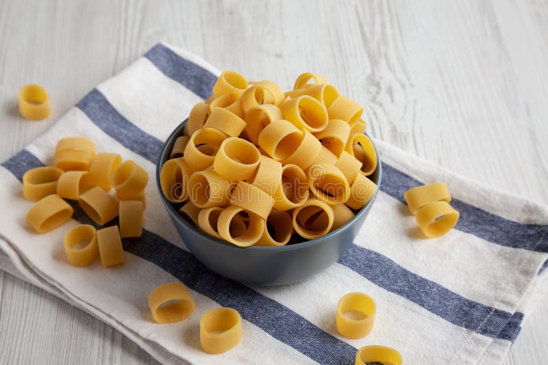 Raw Uncooked Pasta Calamarata in a Bowl, Low Angle View Stock Photo ...