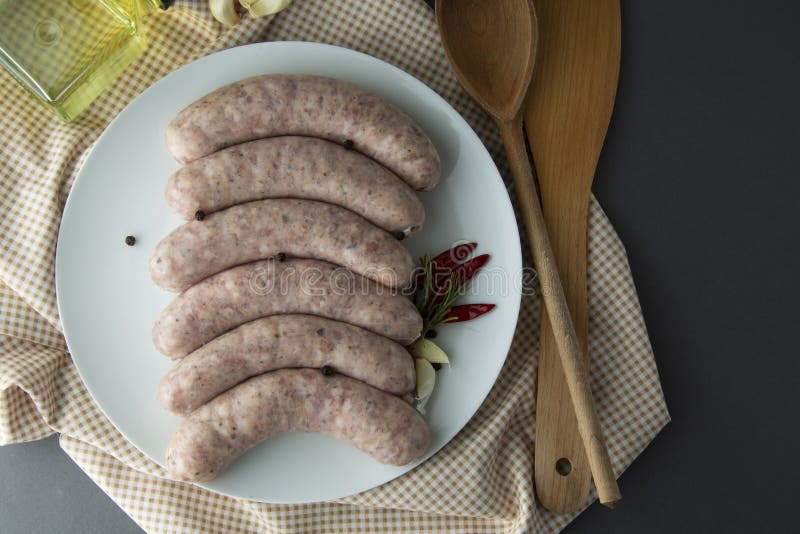 Raw, Uncooked Pork, Meat Sausages on Slate, with Herbs and Spices. Meat ... Raw, Uncooked Pork, Meat Sausages on Slate, with Herbs and Spices. Meat ...