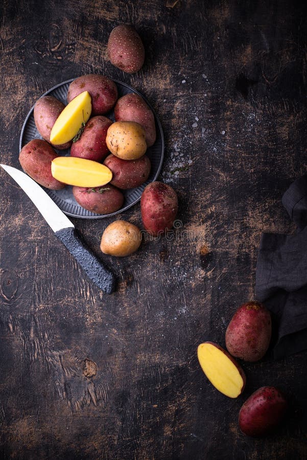 Raw Uncooked Potato on Dark Table Stock Image - Image of healthy, fresh ...