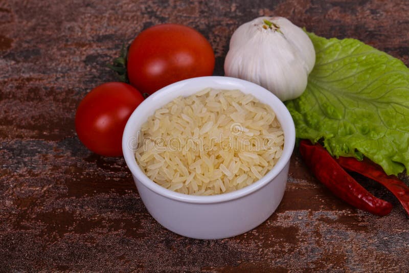 Raw Uncooked Rice in the Bowl Stock Photo - Image of ingredient, pile ...