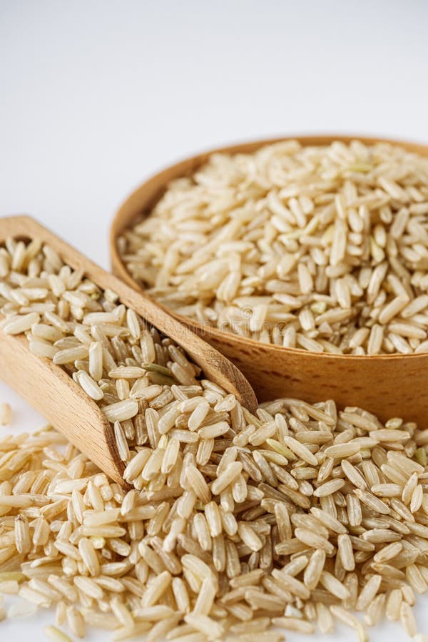 Raw Unpolished Rice on a White Acrylic Background Stock Photo - Image ...