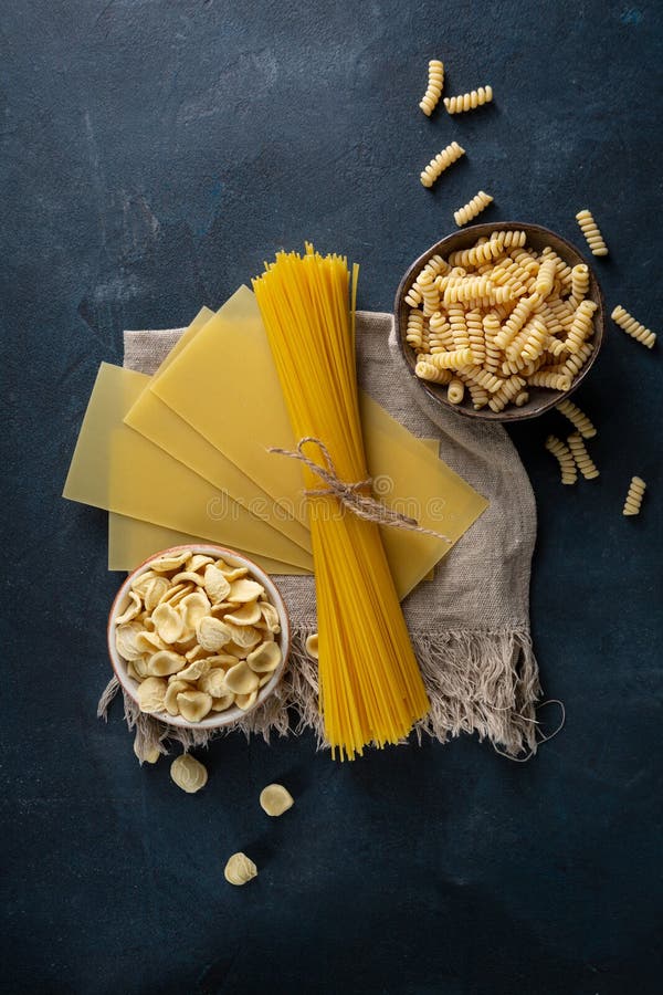 Raw Various Italian Pasta Top View on Dark Surface Stock Image - Image ...