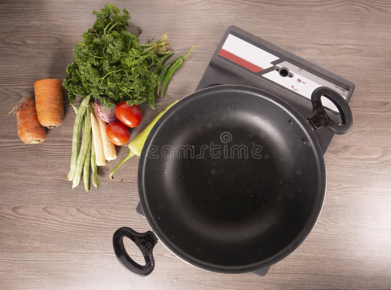 Raw Vegetables with Cooker and Pan - Wooden Texture Table Stock Photo ...