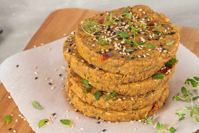 Raw Veggie Burger with Lentils, Vegetables and Thyme Leaves on Kitchen ...