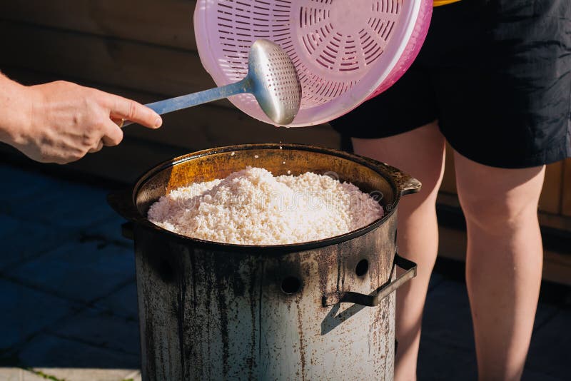 Raw Washed White Rice is Poured into a Cauldron Stock Photo - Image of ...
