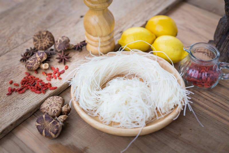 Raw White Noodle on Wooden Table Stock Image - Image of grass, bowl ...