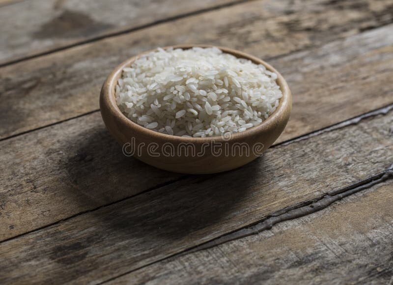 Raw white rice in a bowl stock photo. Image of white - 96318876
