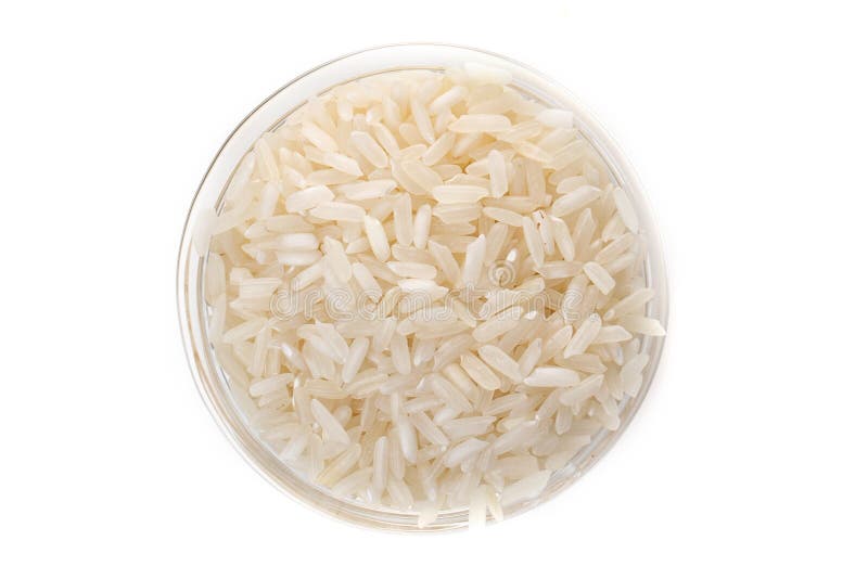 Raw White Rice in a Clear Glass Plate on a White Background Stock Photo ...