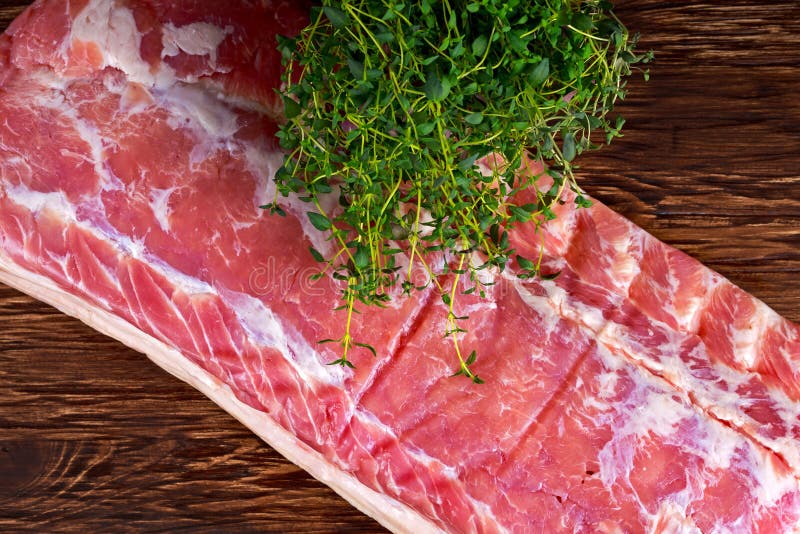 Raw Whole Back Bacon Loin with Herb on Wooden Board Stock Photo - Image ...