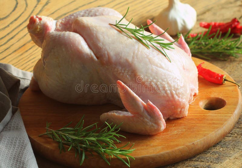 Raw Whole Chicken Ready for Cooking with Herbs on Wooden Table Stock ...