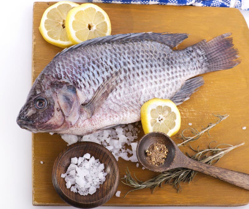 Raw Whole Fish stock image. Image of spice, lemon, herbs - 77576047