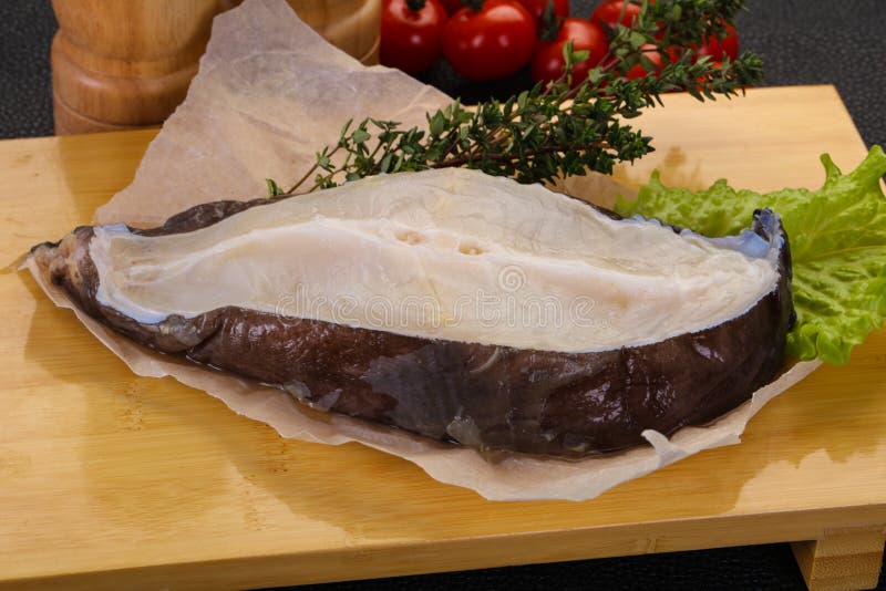 Raw wolffish steak stock image. Image of studio, black - 153084883