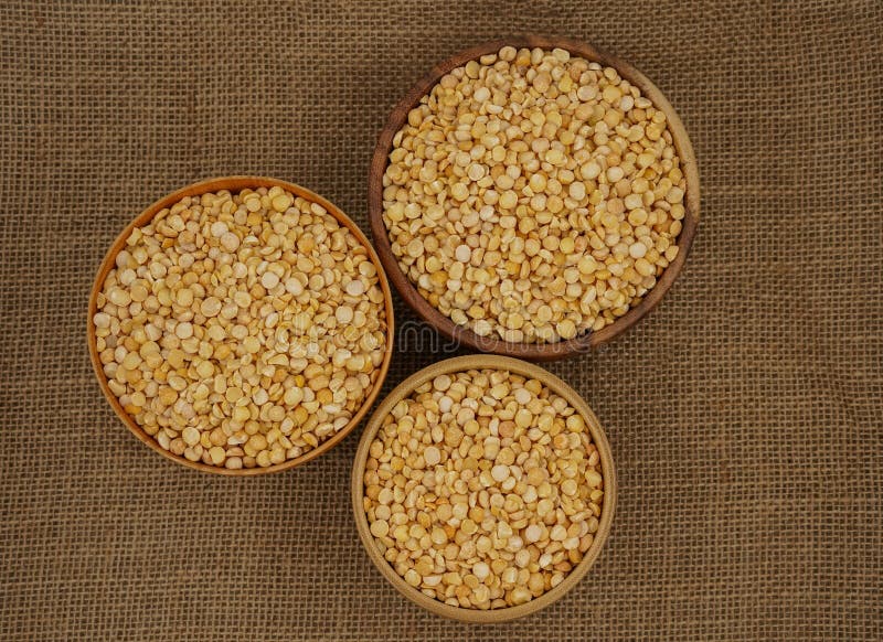 Raw Yellow Split Plate on a Burlap Texture Background Stock Image ...