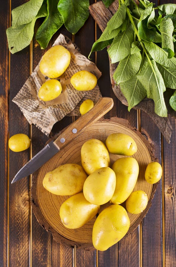 Raw Young Potatoes on a Table Stock Image - Image of young, uncooked ...