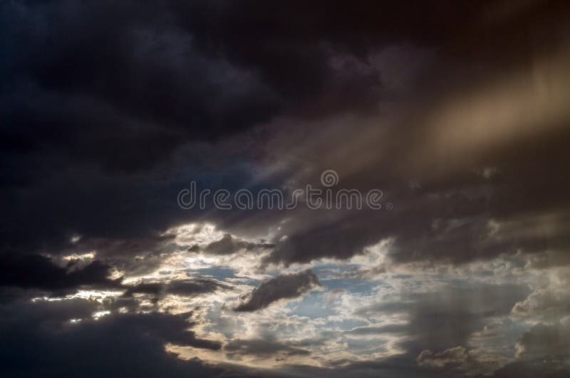 A Ray of Light through the Clouds. Rays of Light Breaking through Dark ...