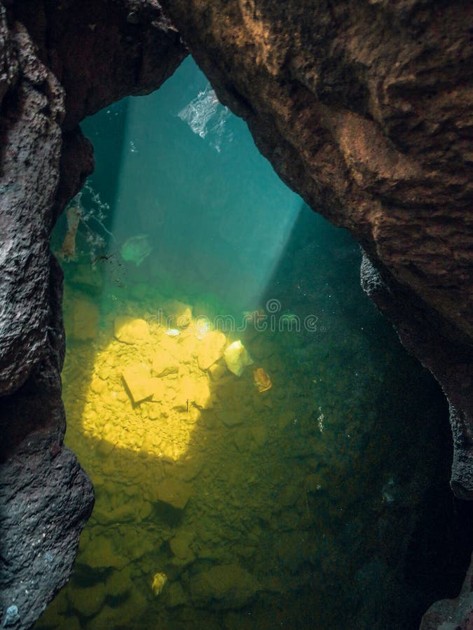 A Ray of Light Hitting the Water and Making Light Trails Stock Image ...