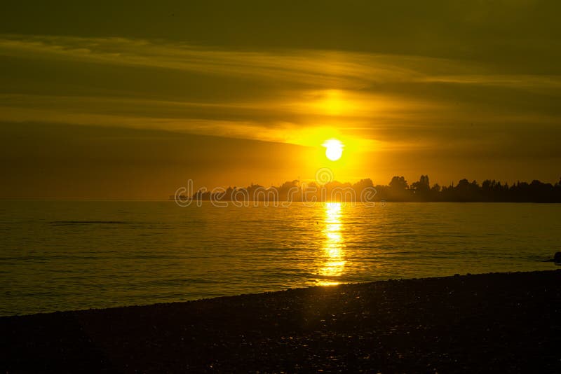 Ray of the Setting Sun on the Dark Beach , Soft Focus Stock Image ...