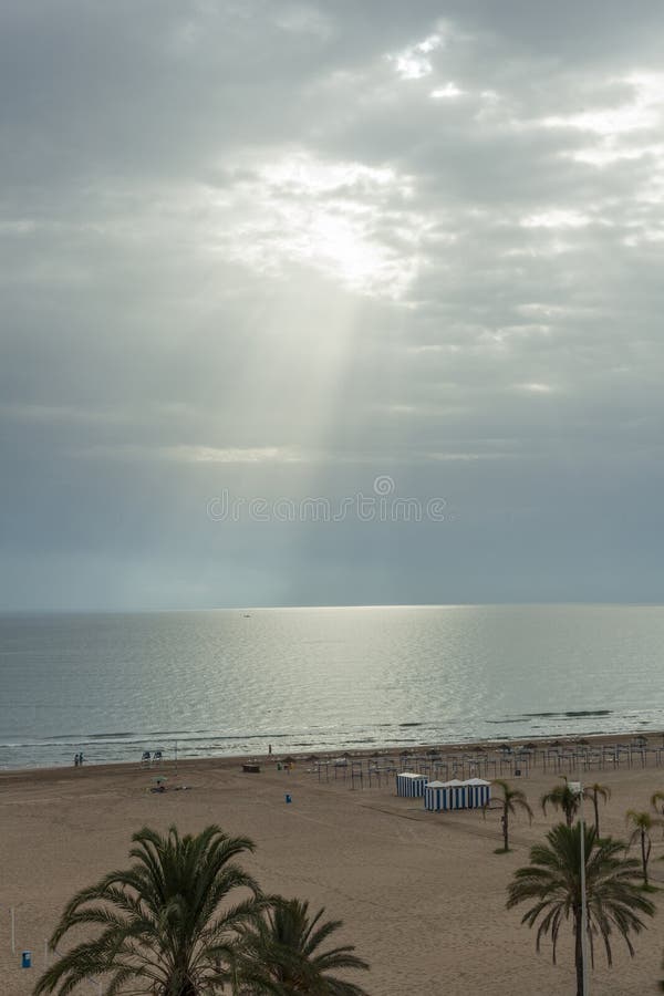 Ray of Sun through the Clouds Lighting the Horizon Line between Stock ...