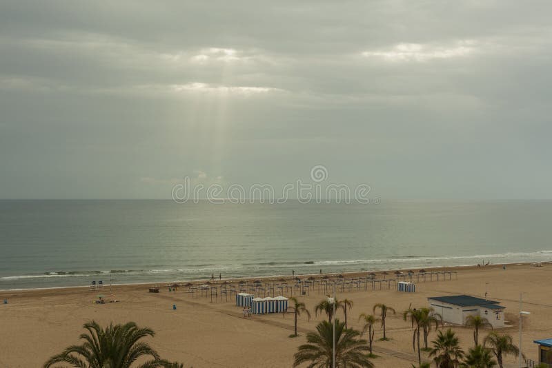 Ray of Sun through the Clouds Lighting the Horizon Line between Stock ...