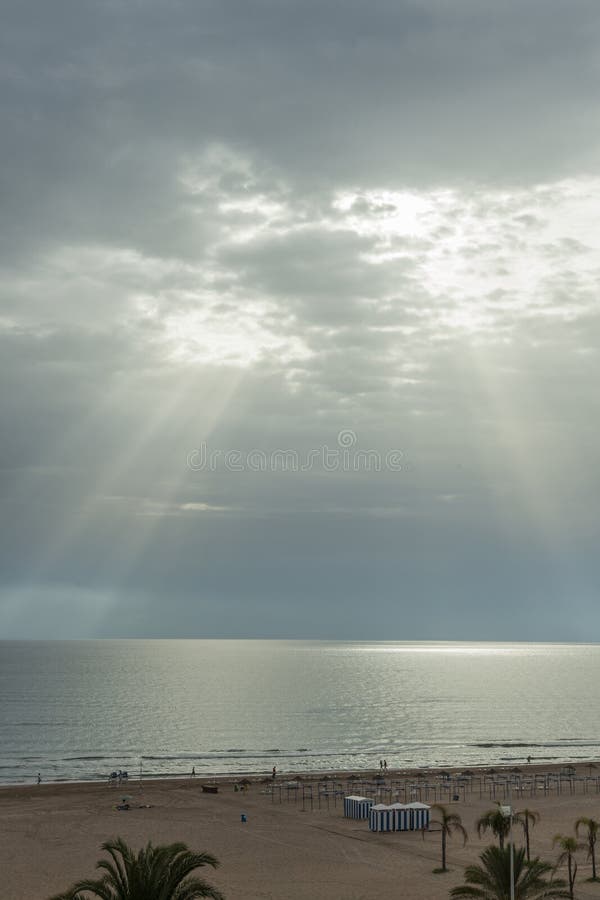 Ray of Sun through the Clouds Lighting the Horizon Line between Stock ...