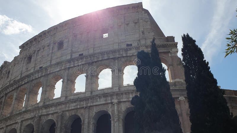 A Ray of Sun Passes through the Arches of the Colosseum in Rome, Italy ...