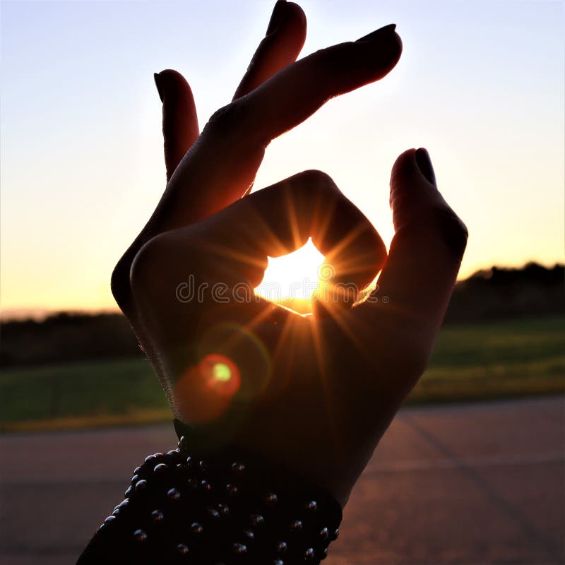 A Ray of Sunshine in the Hand during Sunset Stock Photo - Image of ...