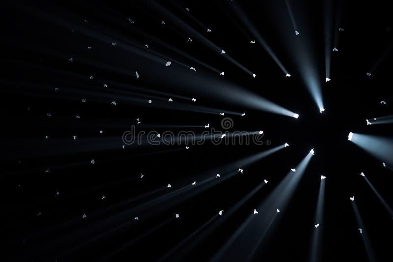 Rays of Bright Light Come through Holes in the Black Background of the ...