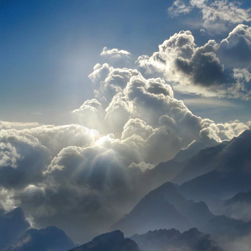 Rays of Dawn through Dense Big Clouds in the Mountains Stock Photo ...