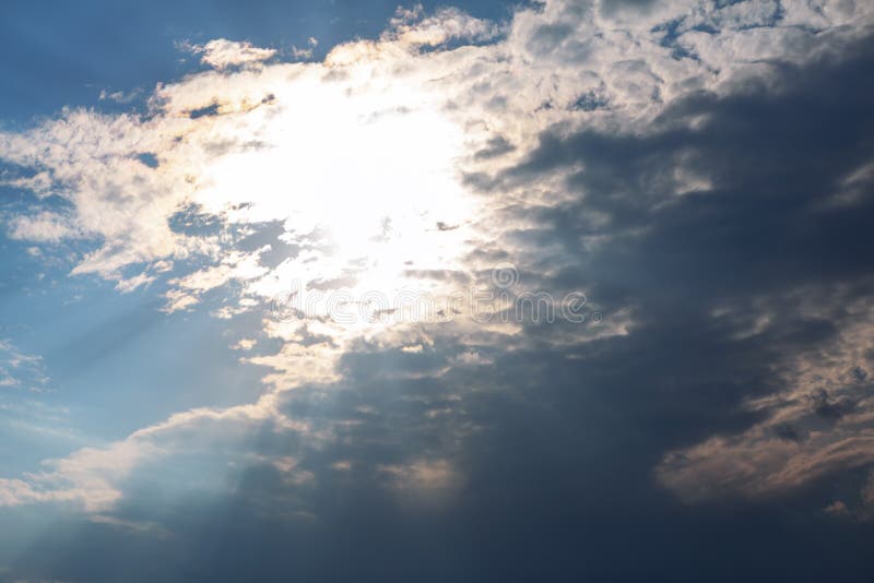 Rays glowing in the clouds stock photo. Image of sunset - 249193596