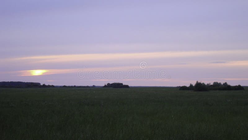 Rays of the Late Sunset Over the Endless Field in the Twilight of the ...