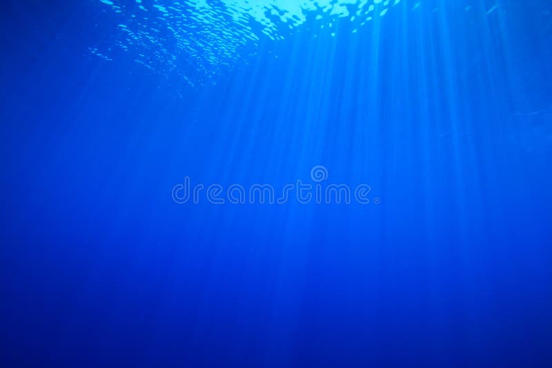 Sun rays in blue water stock photo. Image of texture - 15075914
