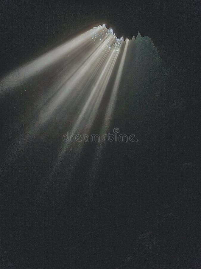 Rays of Light Illuminating a Cave Passage Stock Photo - Image of light ...