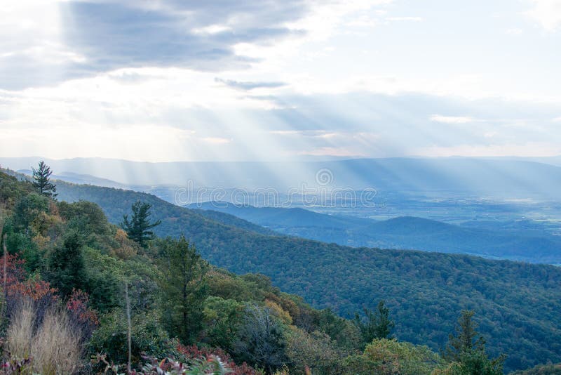 Rays of Light Shine through Clouds Over Blue Ridge Mountains Stock ...