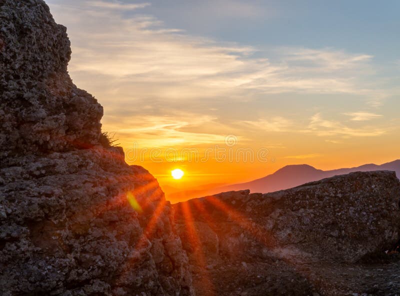 The Rays of the Setting Sun Make Their Way through a Piece of Rock ...