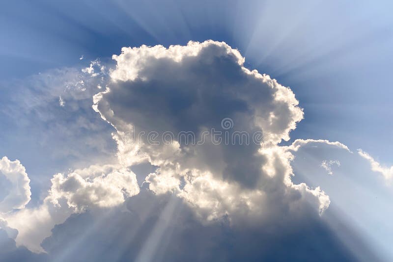 The Rays of the Sun Break through the Blue Clouds Stock Photo - Image ...