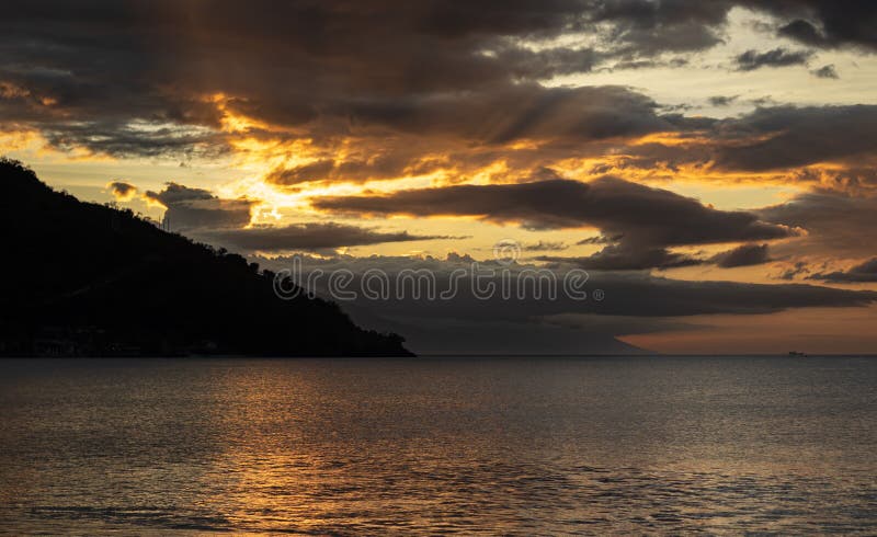 The Rays of the Sun Break through the Clouds at Sunset! Stock Image ...