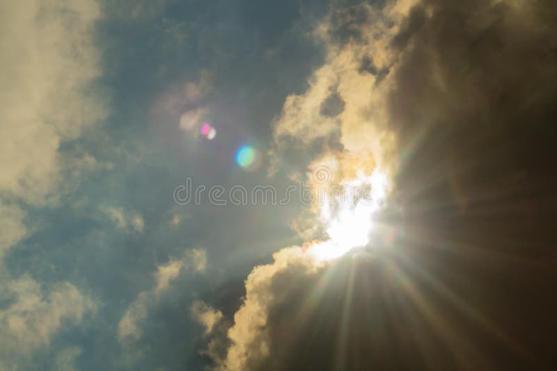 The Rays of the Sun Break through from the Edge of a Huge Dark Cloud ... The Rays of the Sun Break through from the Edge of a Huge Dark Cloud ...