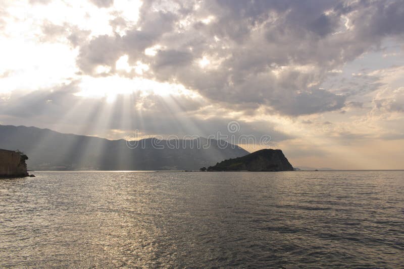 Rays Sun Falling through Clouds on the Sea. Selective Focus Stock Image ...