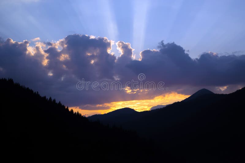 Rays of the Sun Making Their Way through the Clouds Against the ...