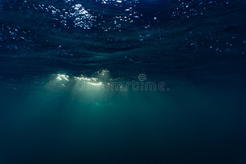 Rays Of Light Shining Through The Surface Of The Atlantic Ocean Into