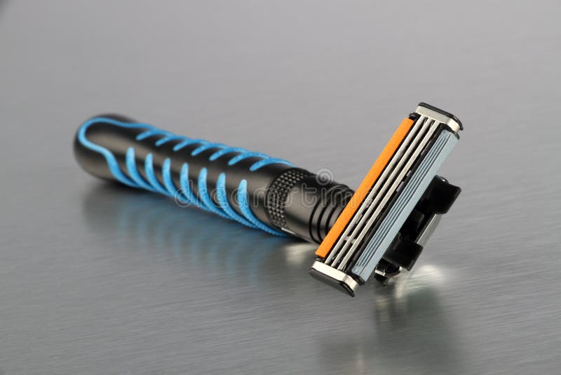 Razor Blade Closeup on Brushed Steel Background Stock Image - Image of ...