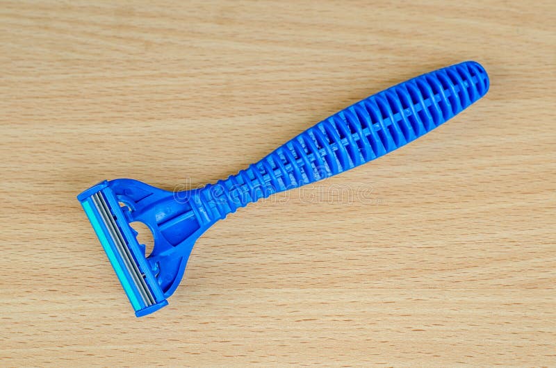 Razor Blade Shows the Front and Back of a Blue Handle Stock Photo ...