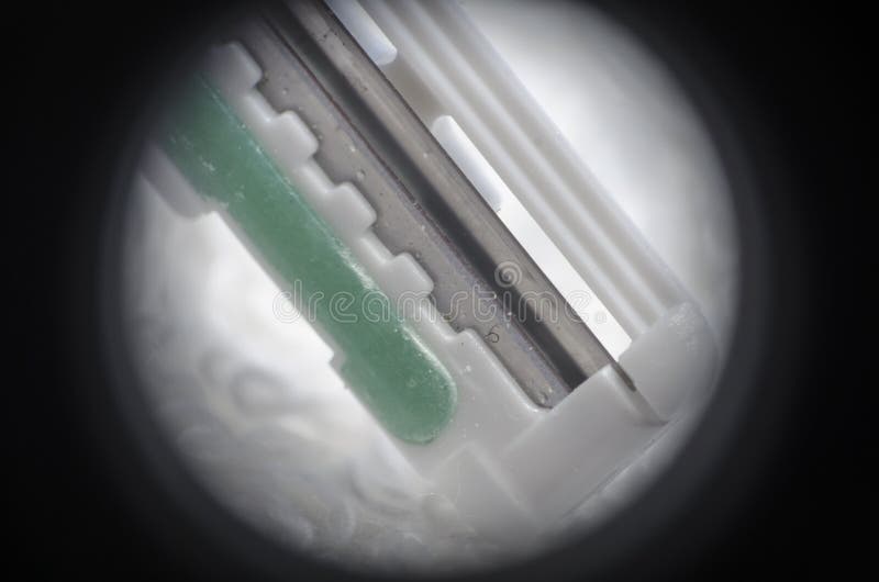 Razor in microscope stock photo. Image of barber, care - 64455260