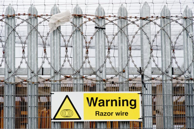 Razor Wire Warning Sign on Security Fence at Construction Site Stock ...