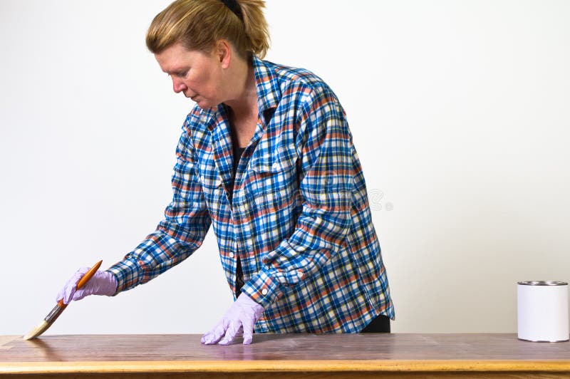 Re-finishing a table stock photo. Image of brushing, painter - 22663988
