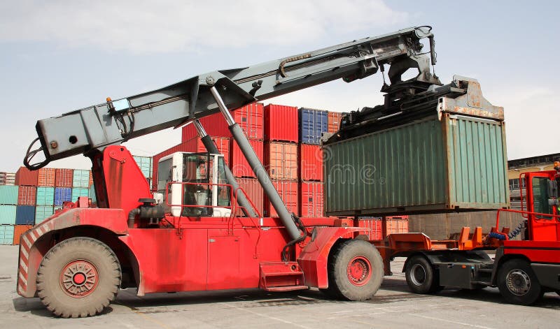 Reach Stacker Vehicle Moving a Container into a Container Terminal Area ...