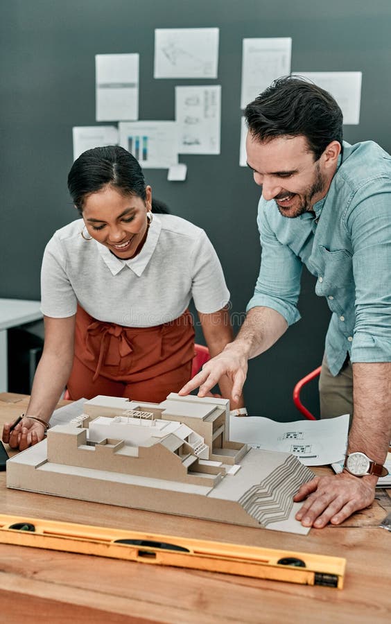 Reaching the Completion of Another Project. Two Architects Working ...