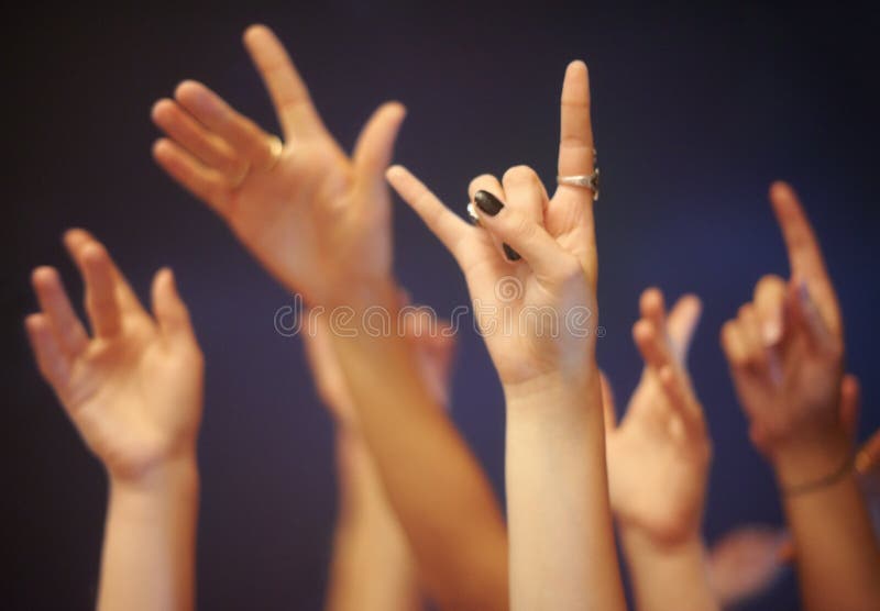 Reaching Out To the Performers. Cropped Image of Hands Raised and ...